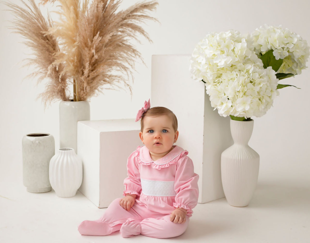 Girls pink smocked baby grow – Clark & Beau